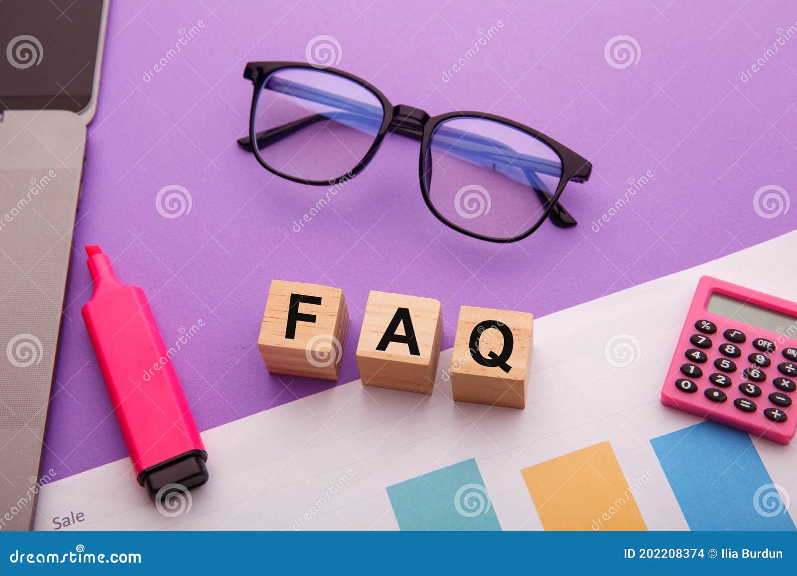 Wooden Blocks with Word FAQ on Pink Work Table. Frequently Asked ...
