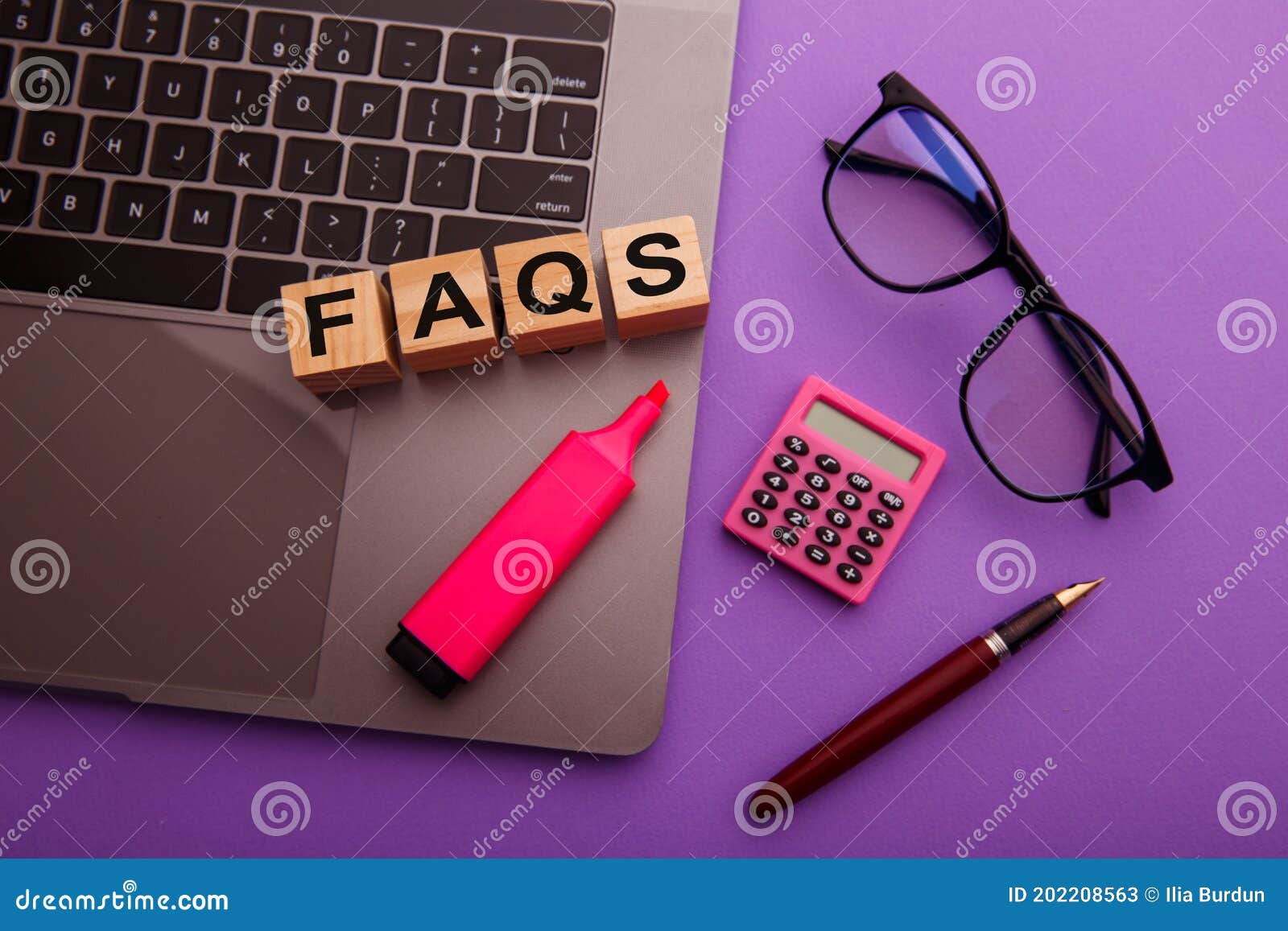 Wooden Blocks with Word FAQS on Pink Table. Frequently Asked Question ...