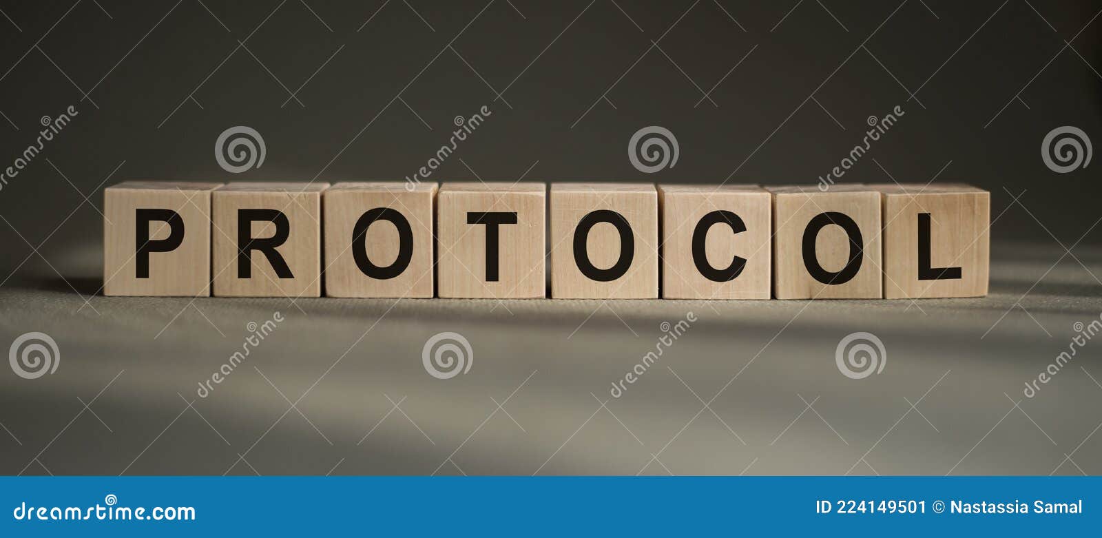 A Wooden Blocks with the Word PROTOCOL Written on it on a Gray ...