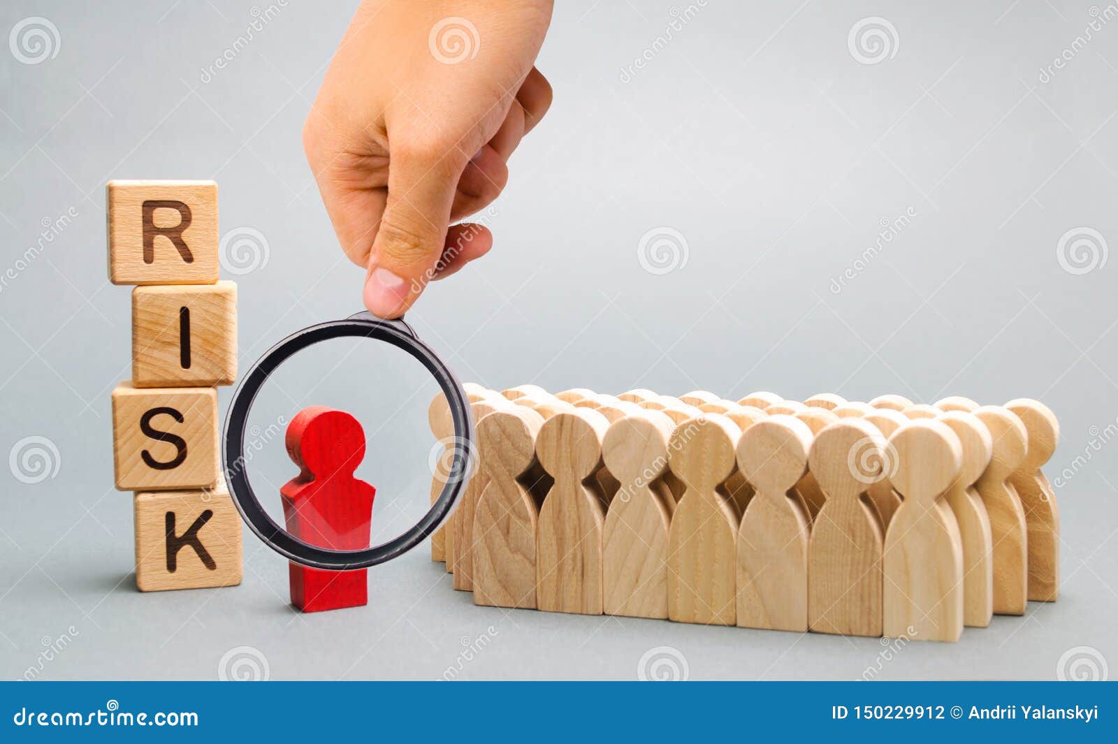 Wooden Blocks with the Word Risk and a Team with a Leader. Business ...