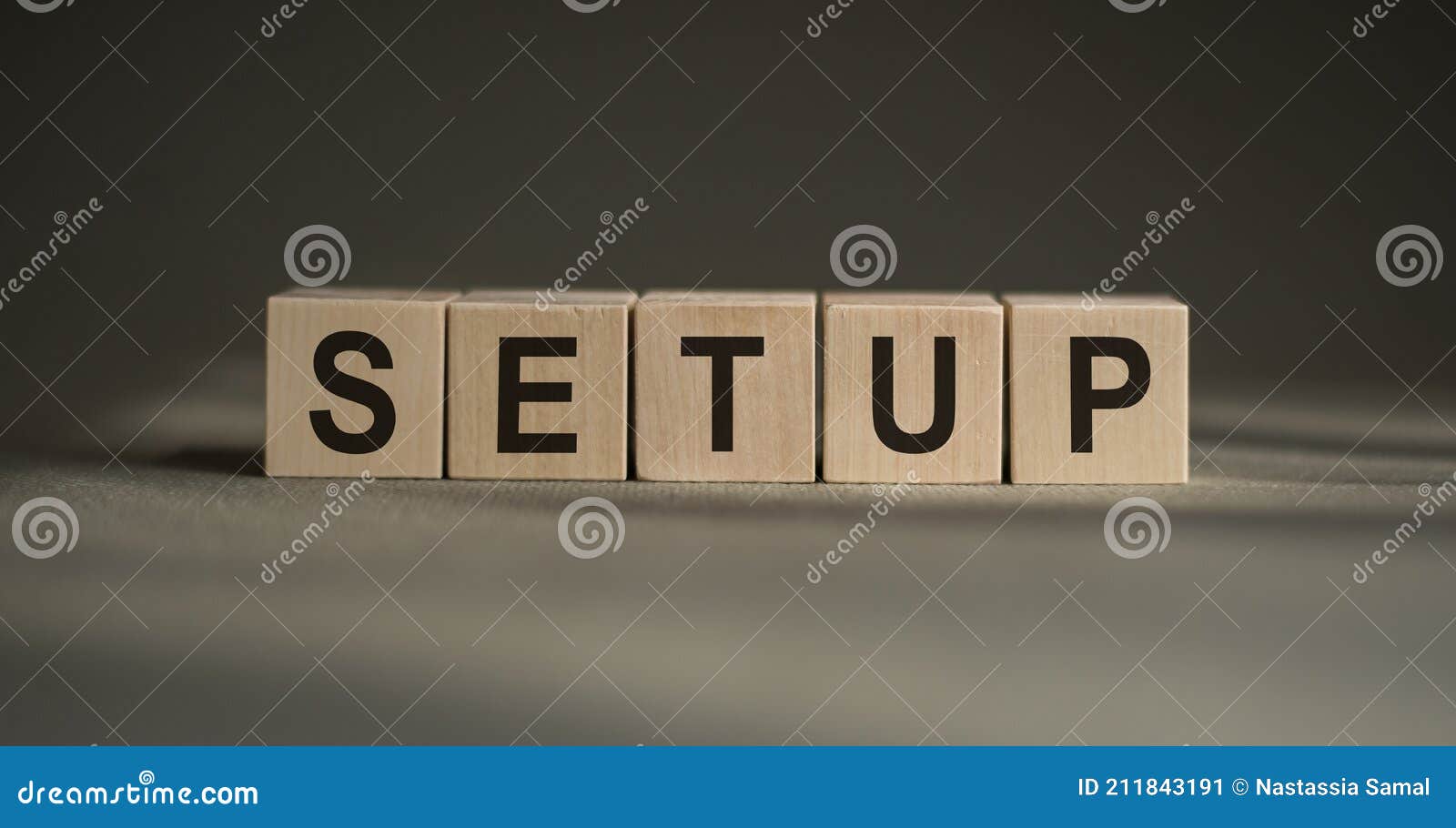 A Wooden Blocks with the Word SETUP Written on it on a Gray Background ...