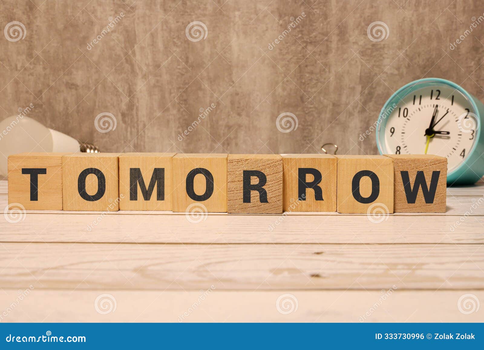 A Wooden Blocks with the Word TOMORROW Written on it on a Gray ...