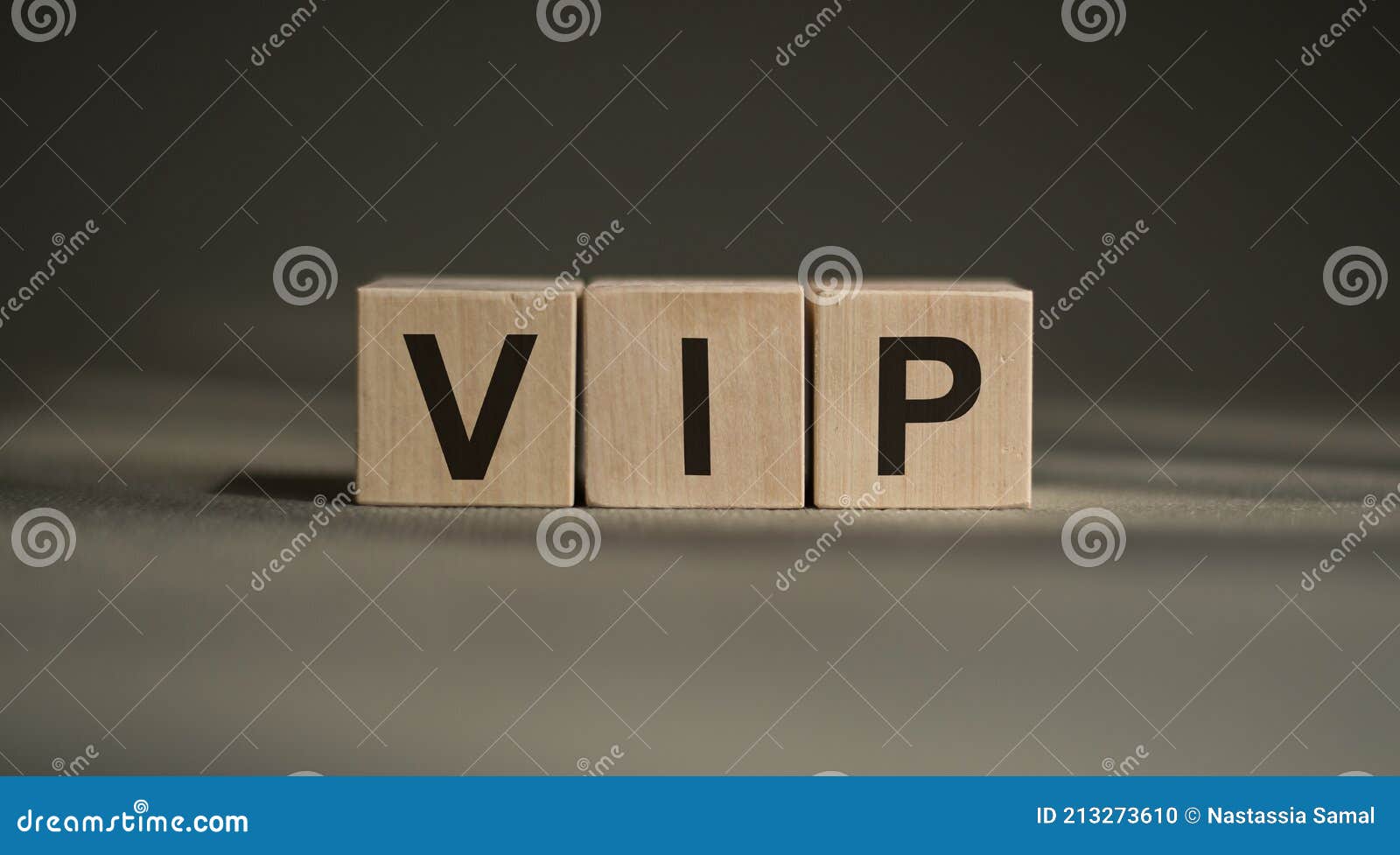 A Wooden Blocks With The Word VIP Written On It On A Gray Background ...