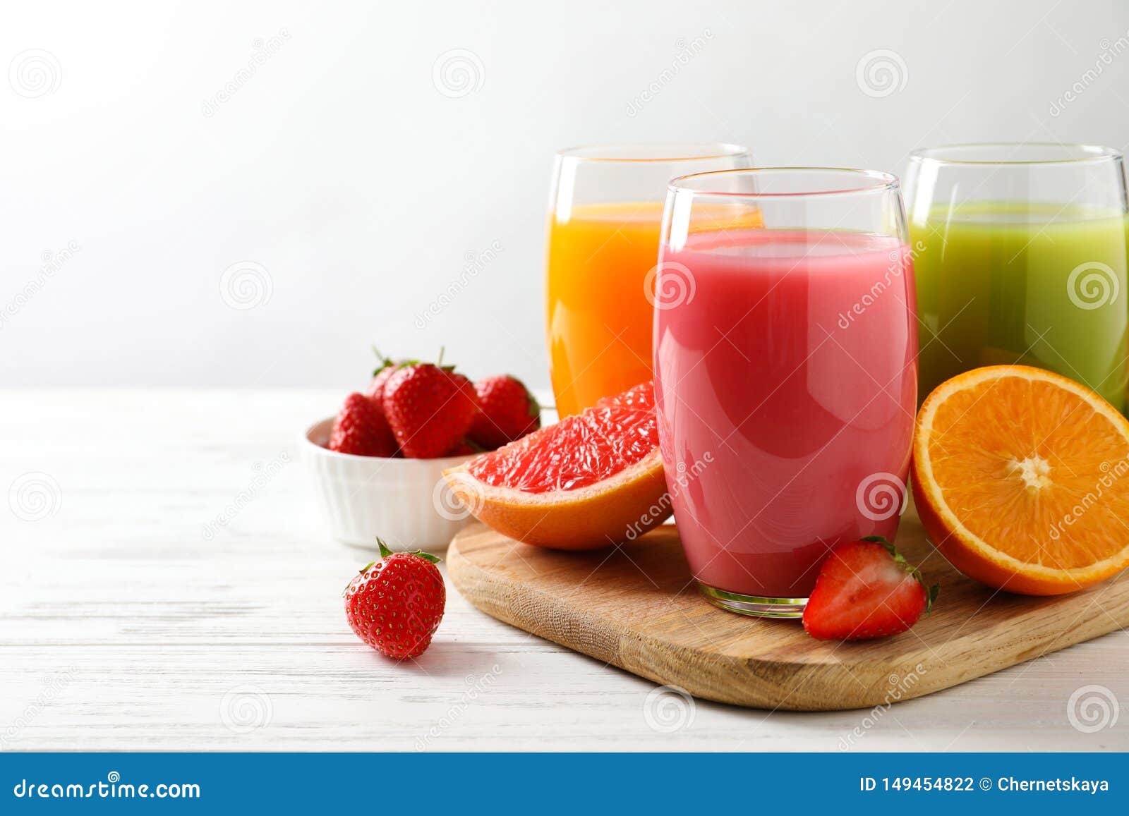 Wooden Board with Different Juices and Fresh Fruits on Table Stock ...