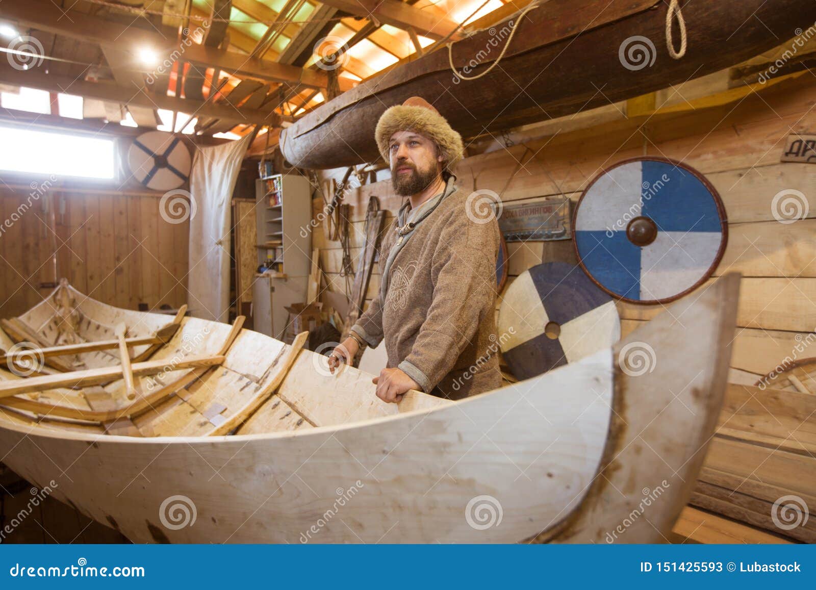 Wooden boat in the barn stock image. Image of living - 151425593