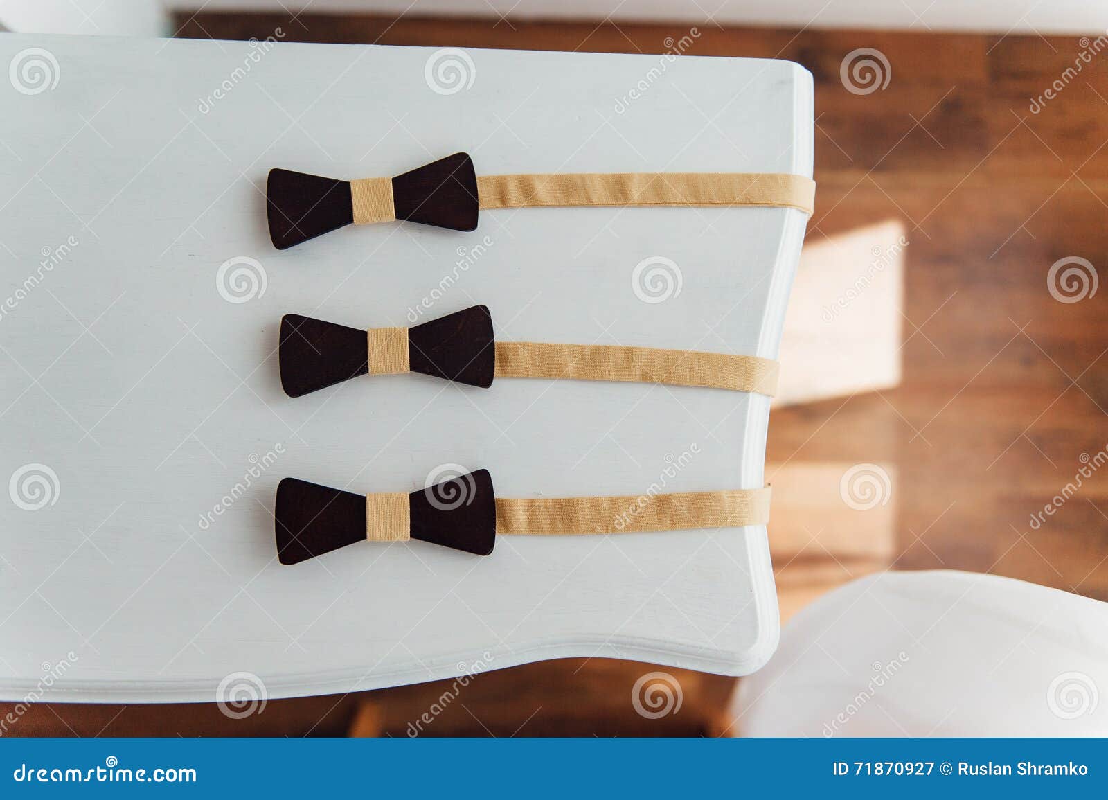 Wooden Bow Ties on a Ivory Table Stock Image - Image of drilled ...