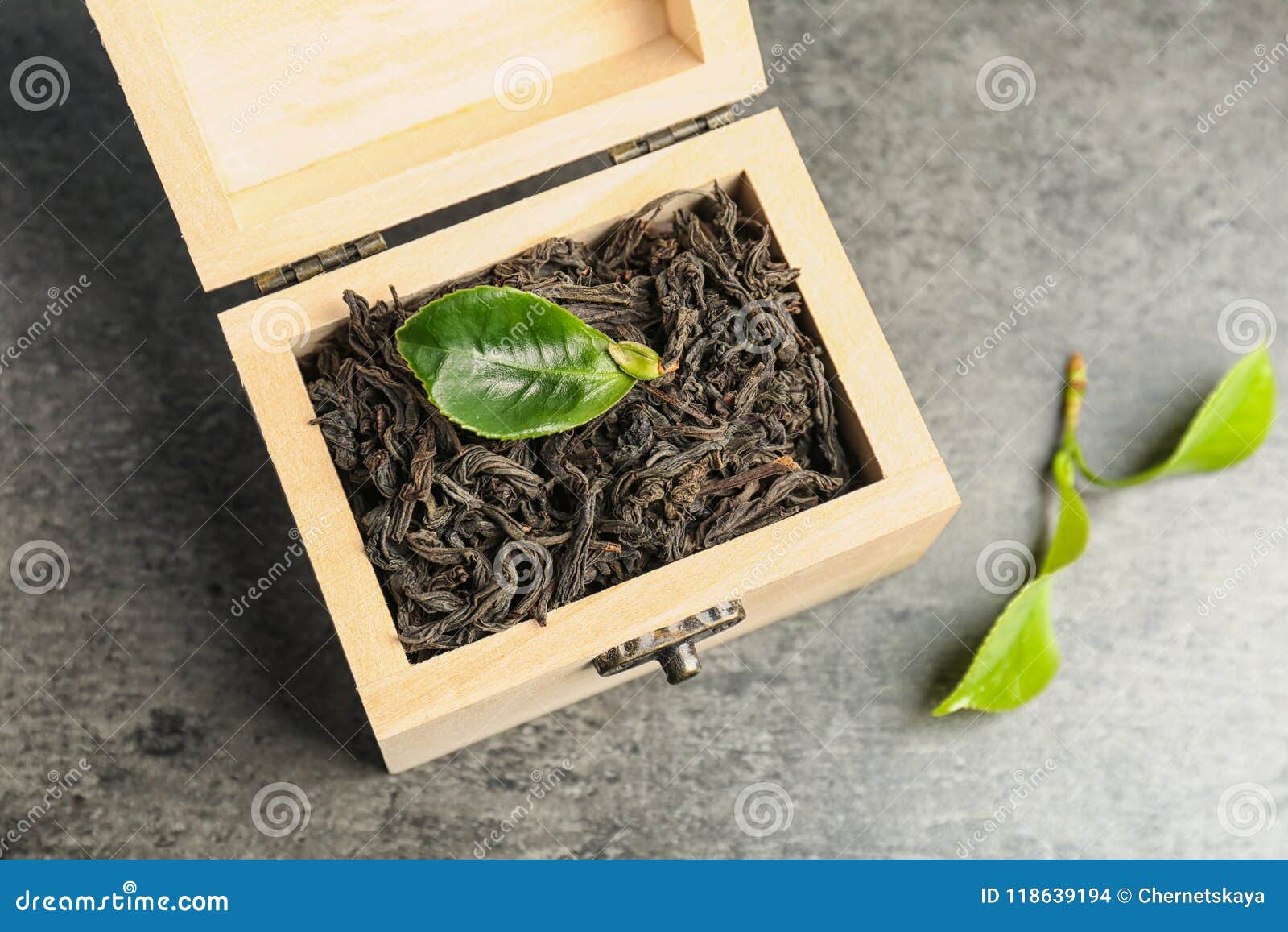 Wooden Box with Dry Tea and Green Leaves Stock Photo - Image of ...