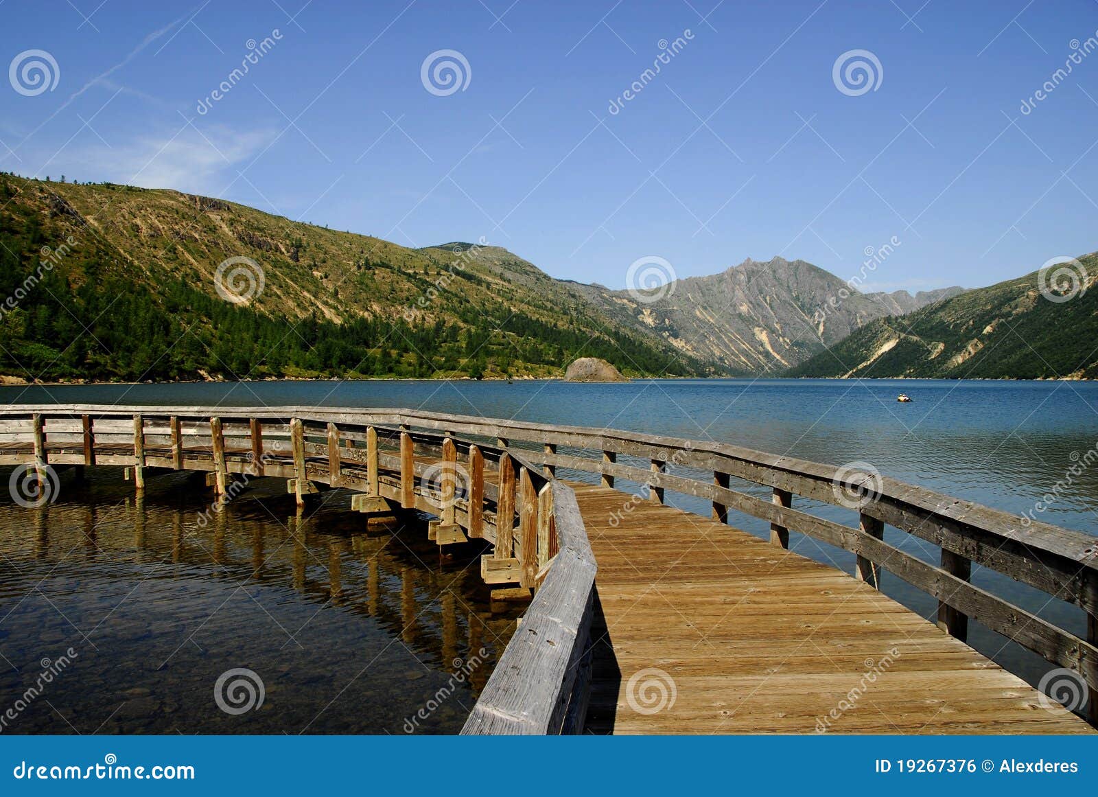 Wooden Bridge Across the Lake Stock Photo - Image of bridge, blue: 19267376