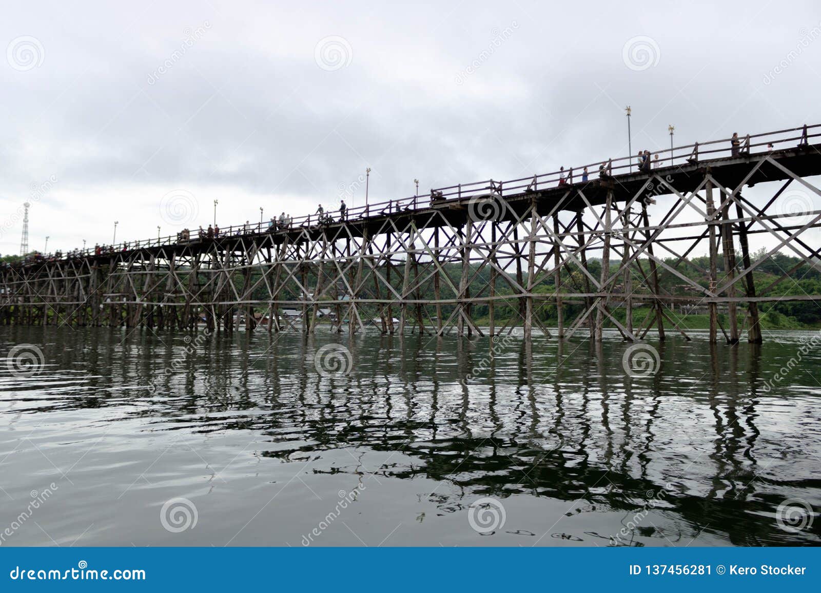 Wooden bridge across river stock image. Image of community - 137456281