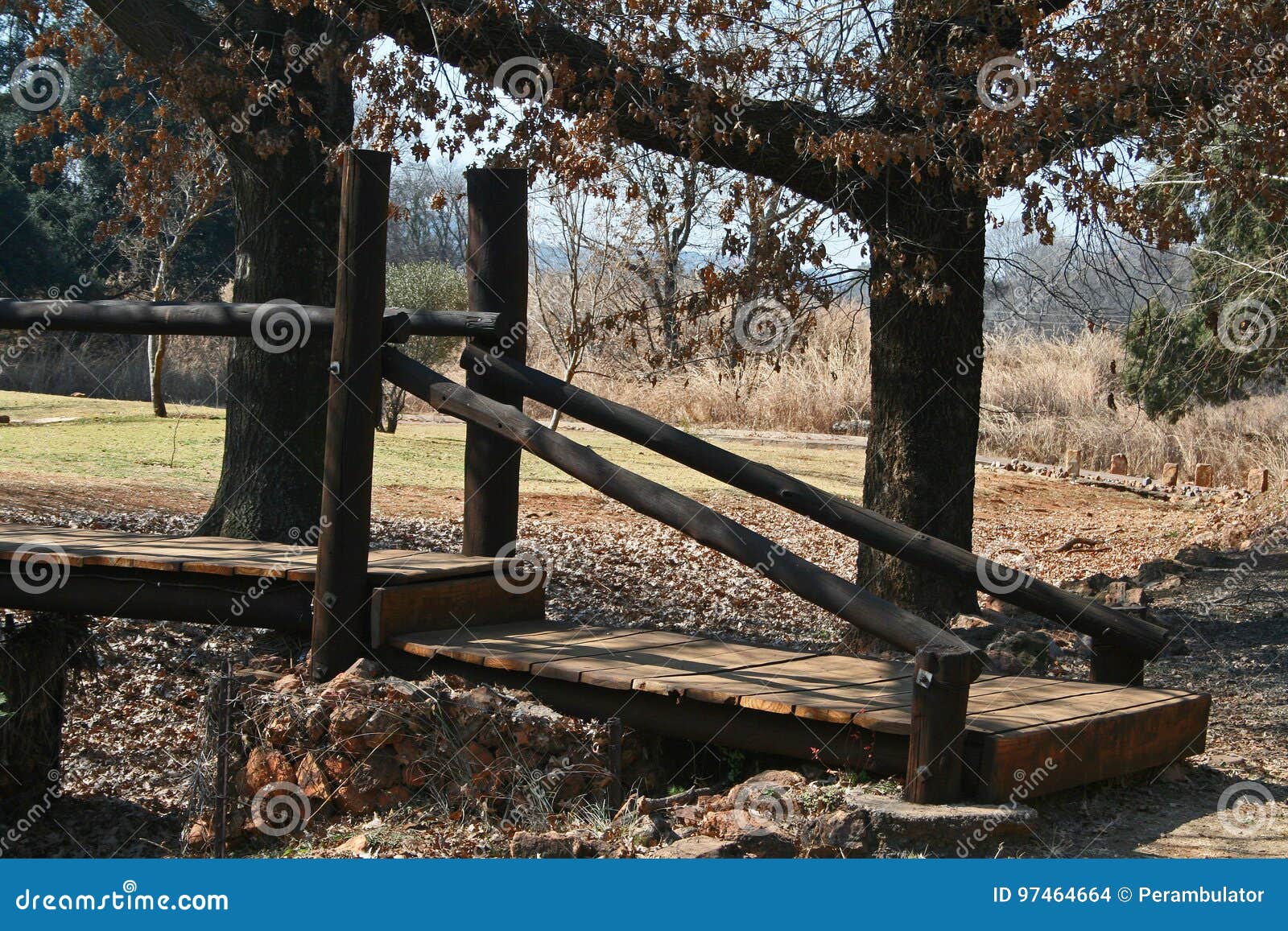 WOODEN BRIDGE OVER DITCH stock photo. Image of wooden - 97464664