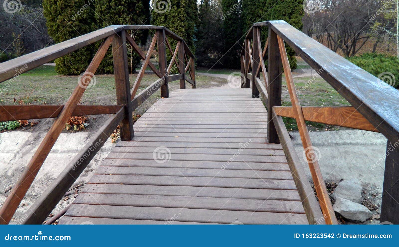 Wooden Bridge Over a Small River in the Park Stock Photo - Image of ...