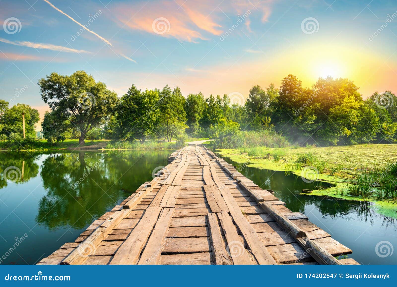 Wooden bridge at sunset stock image. Image of evening - 174202547