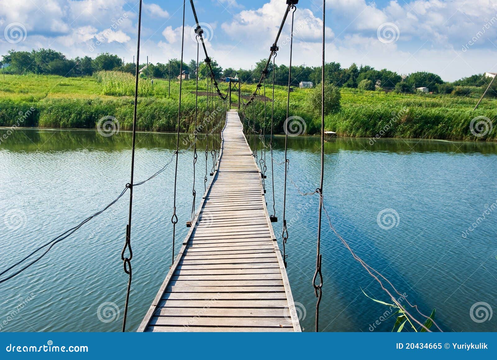 Wooden bridge in a village stock image. Image of puddle - 20434665
