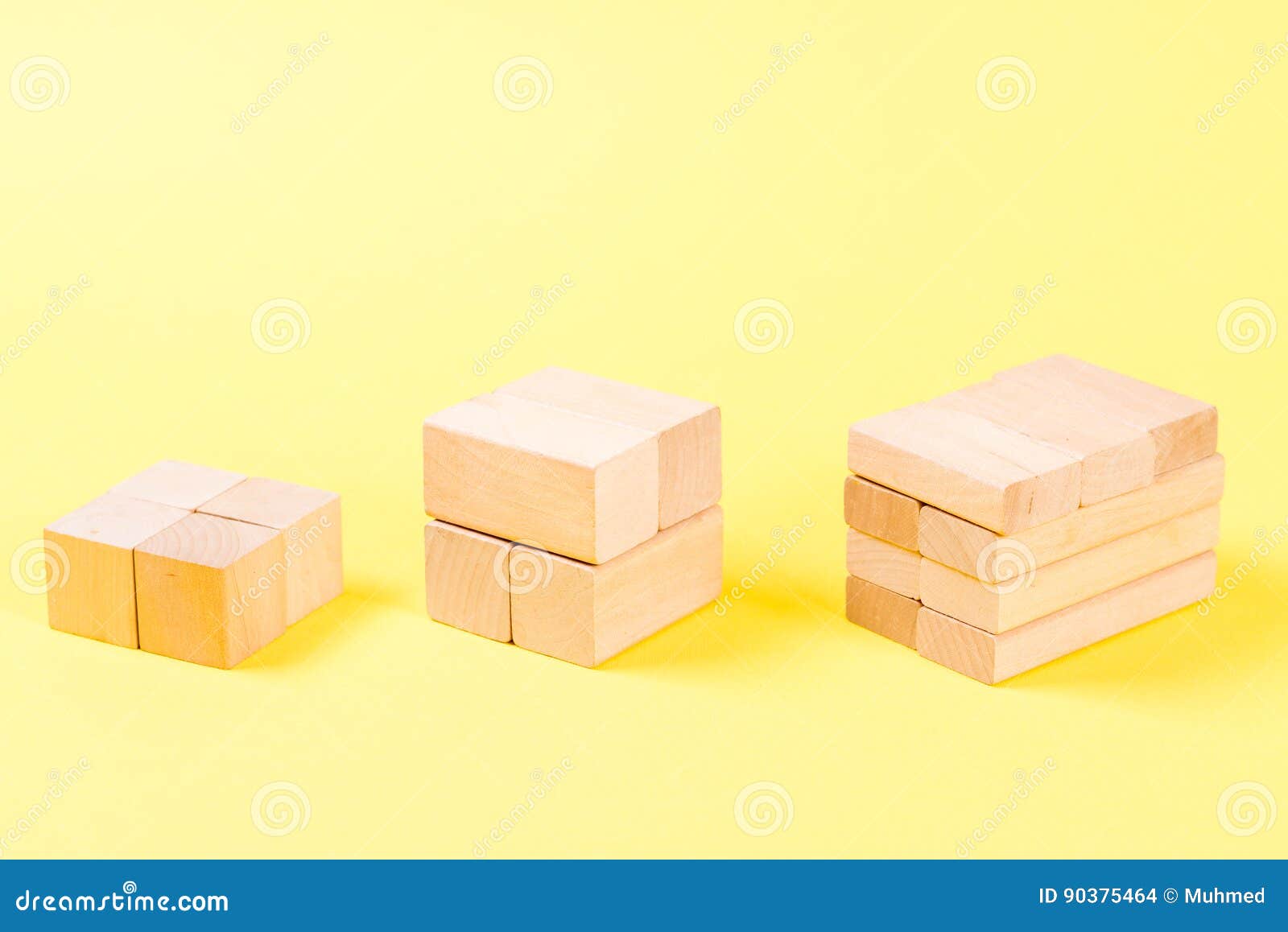 Wooden Building Blocks on Yellow Background. Stock Photo - Image of ...