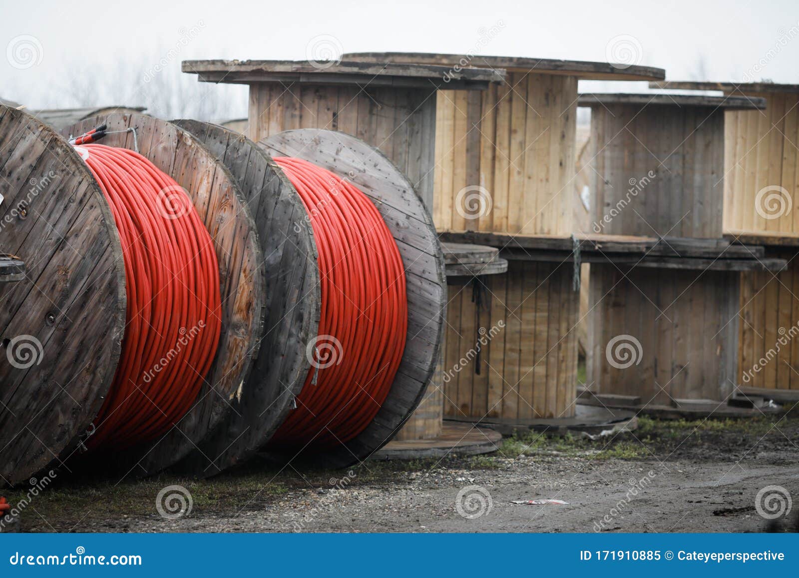 Wooden Cable Reels Outdoors during a Cold Rainy Day Stock Image - Image ...