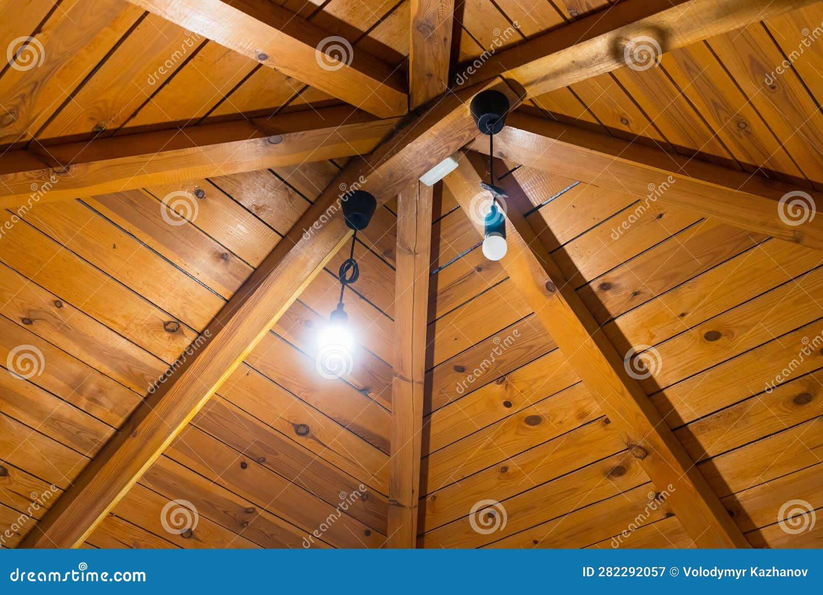 Wooden Ceiling with Electric Light Bulbs Hanging on a Wire Stock Image ...
