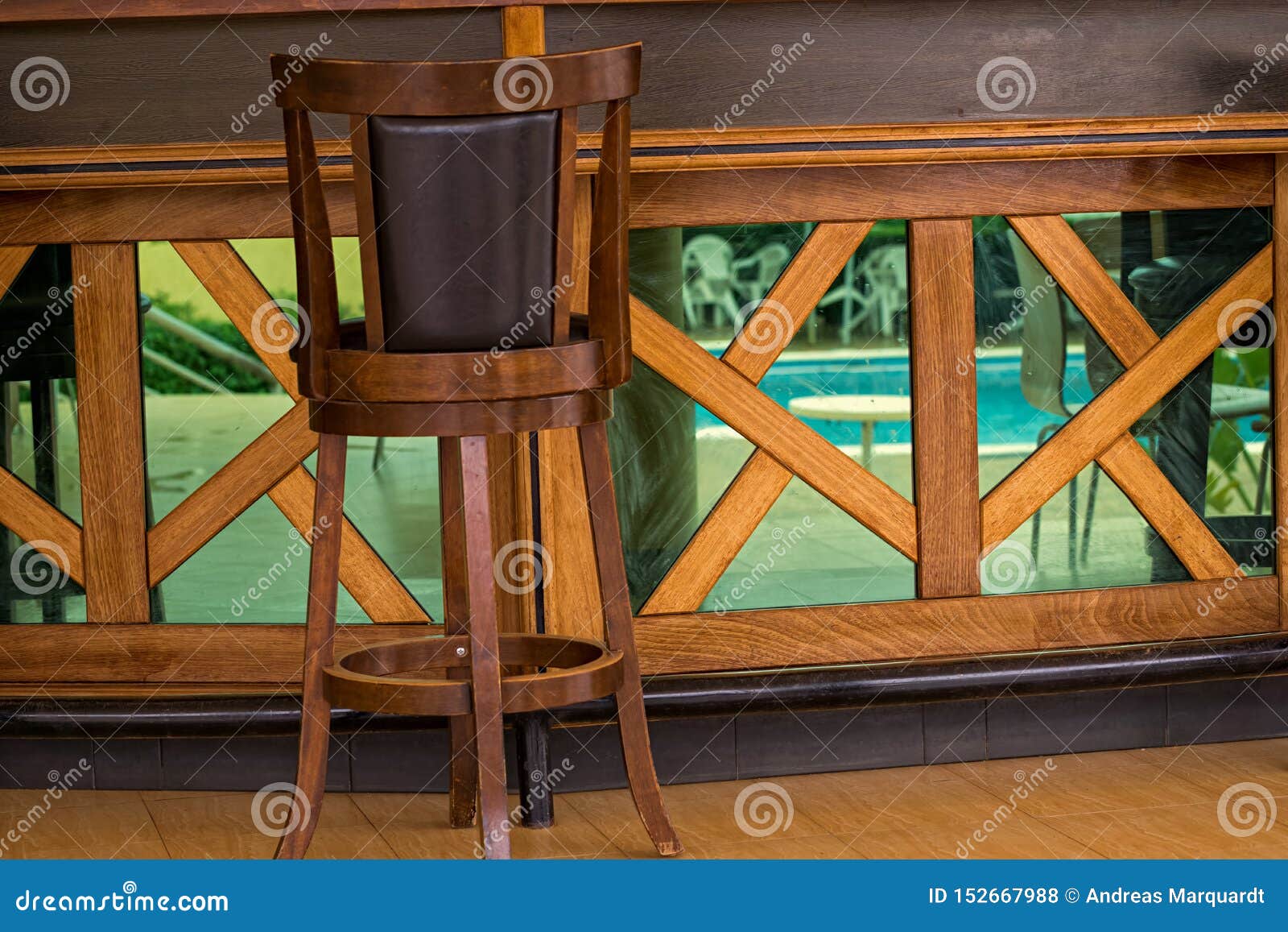 A Wooden Chair in Front of a Bar Stock Photo - Image of design, front ...
