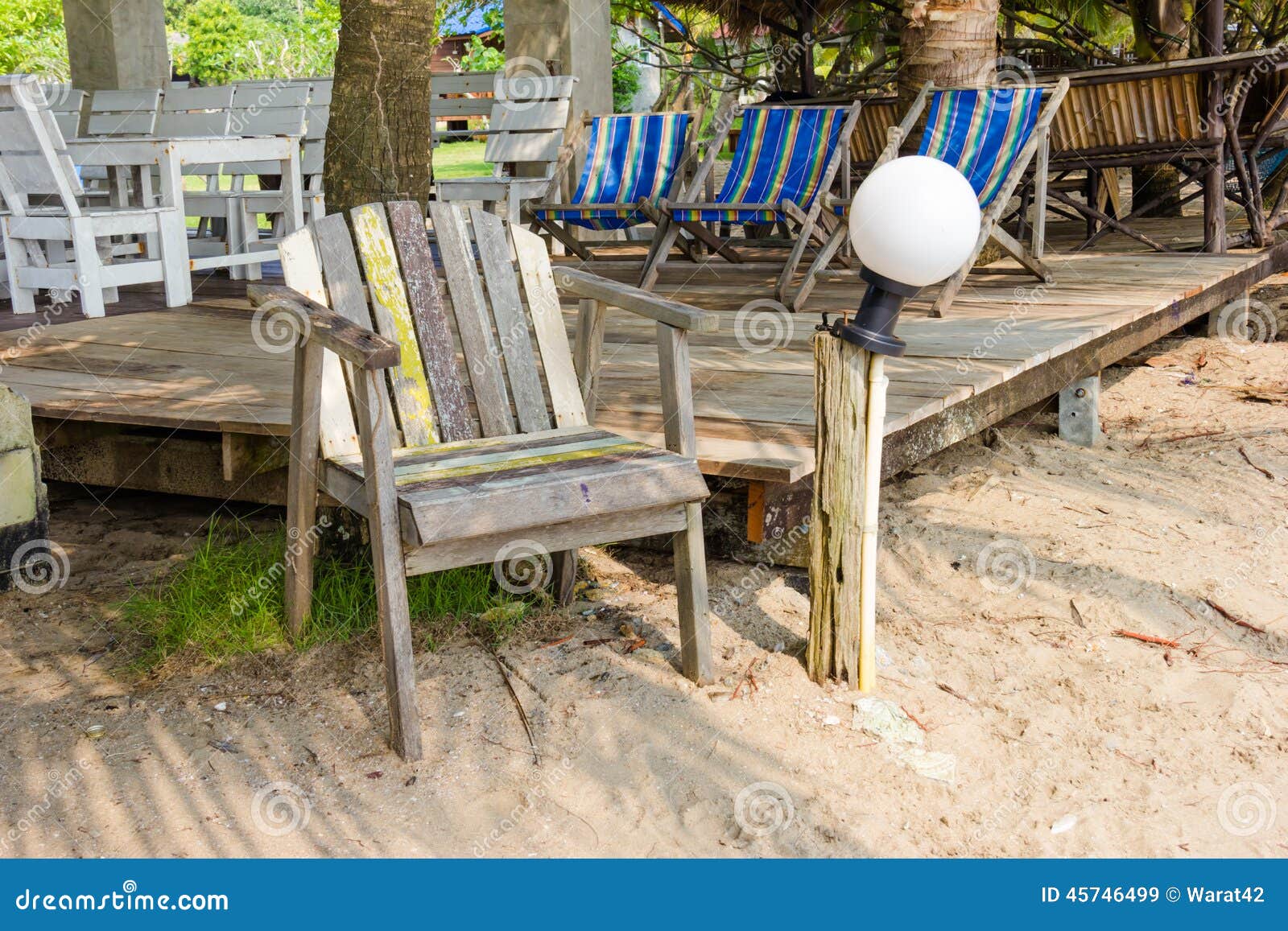 Wooden chairs on the beach stock image. Image of wooden - 45746499