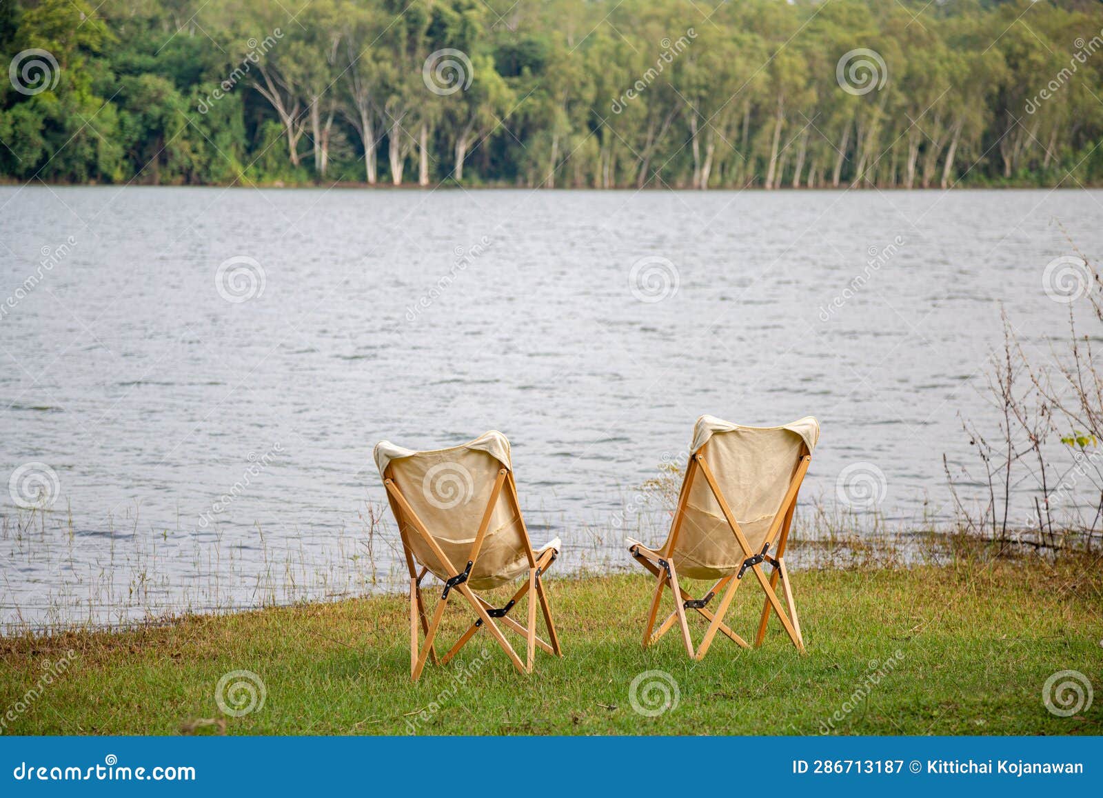 Wooden Chairs Overlooking the Lake the Back is a Forest Stock Image ...