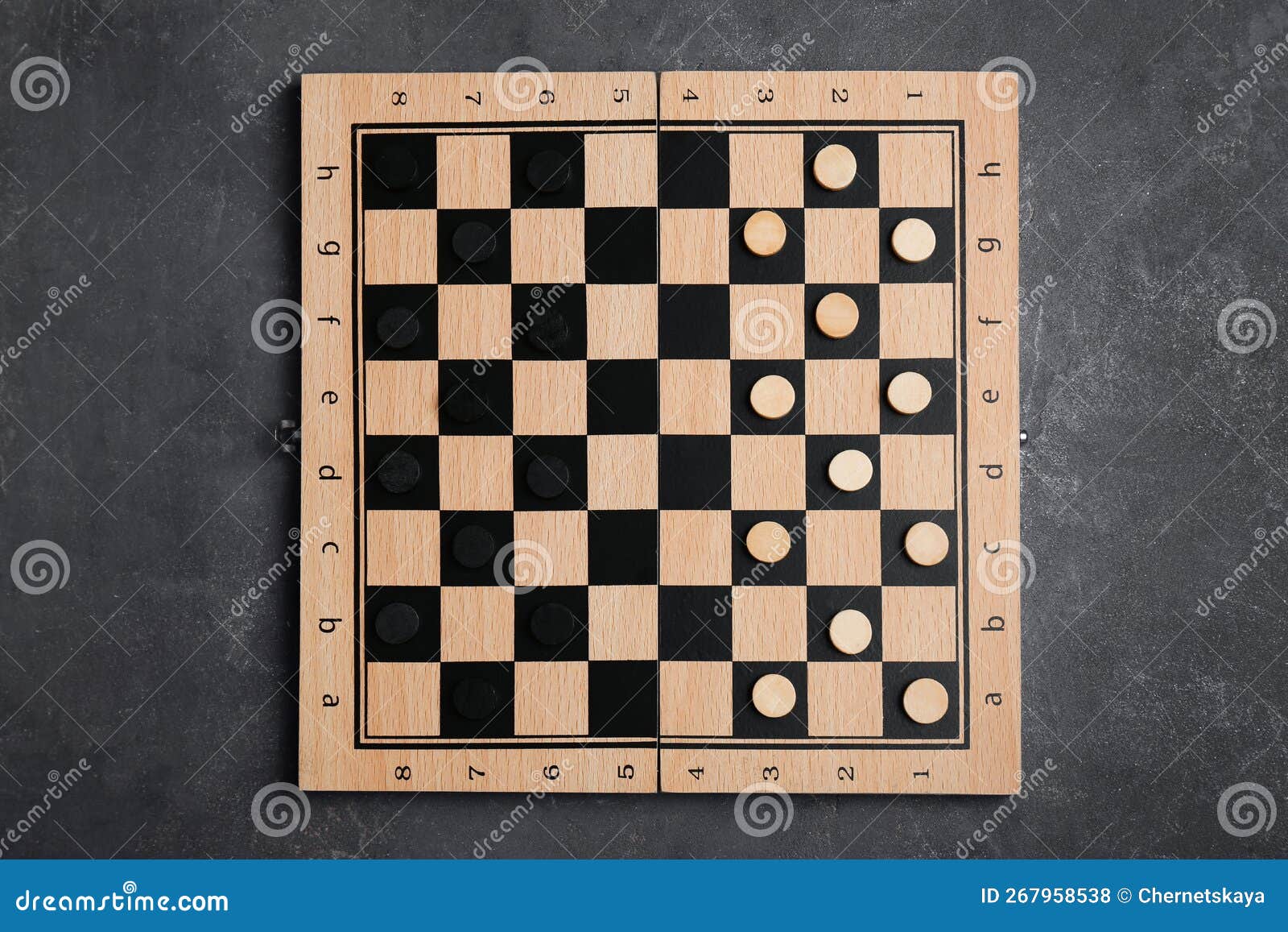 Wooden Checkerboard with Game Pieces on Grey Table, Top View Stock ...