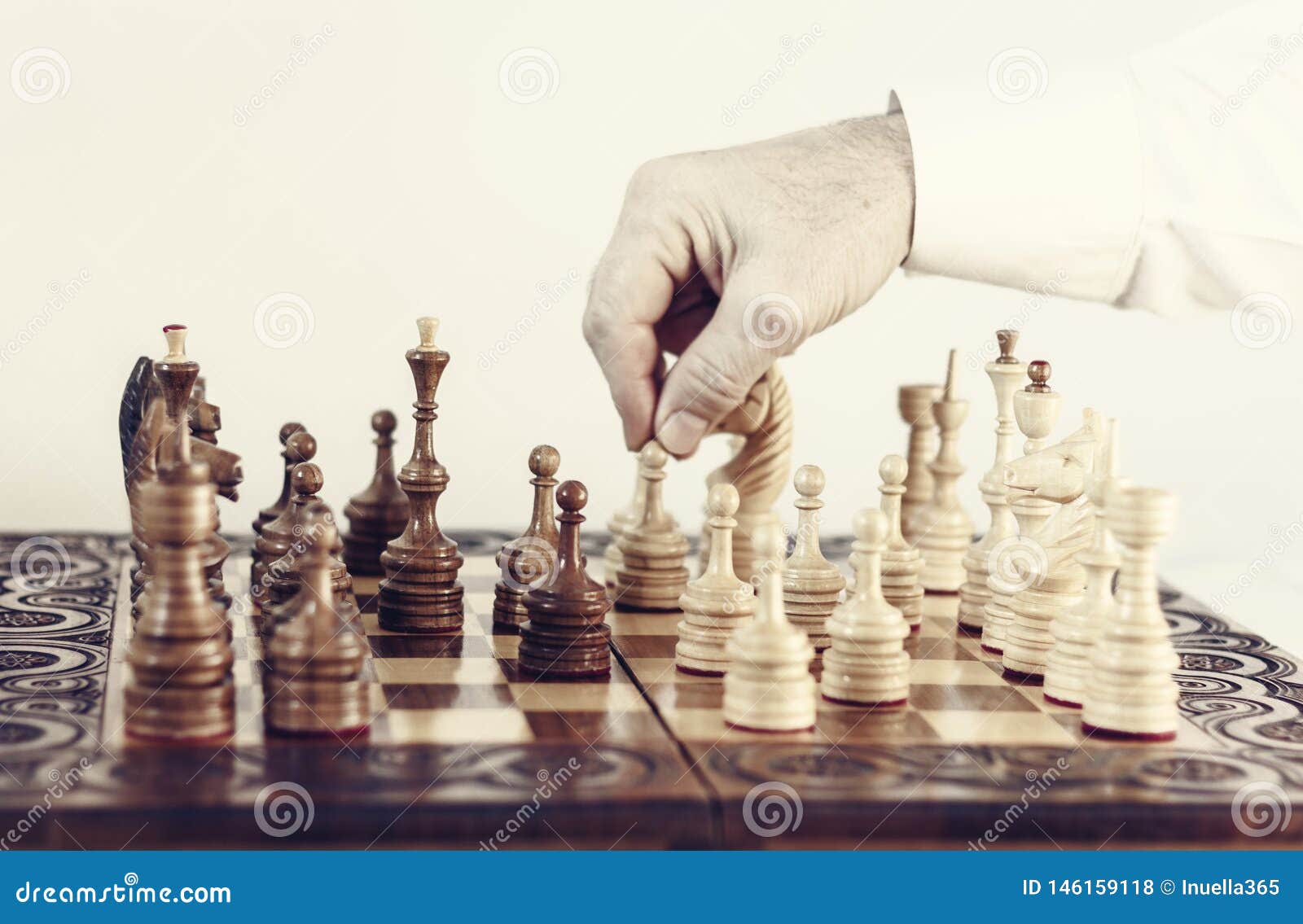 Wooden Chess Pieces on a Chessboard, Chess Game Player Makes a Move ...