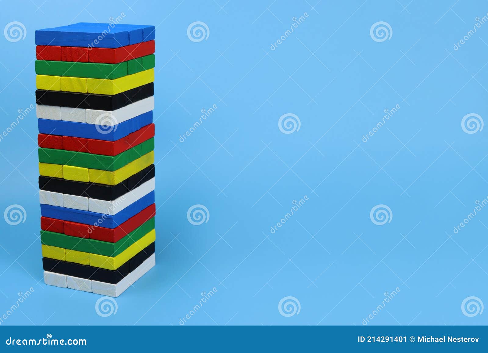 Wooden Colored Tower Blocks Game on Blue Background. Copy Space for ...