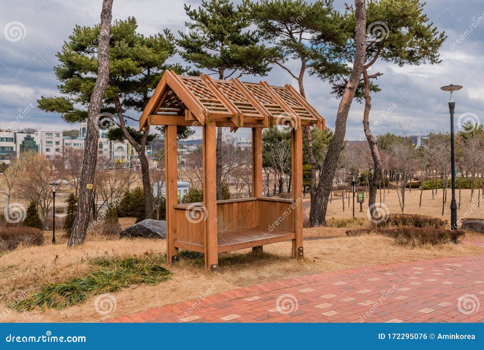 Wooden covered park bench stock photo. Image of playground - 172295076