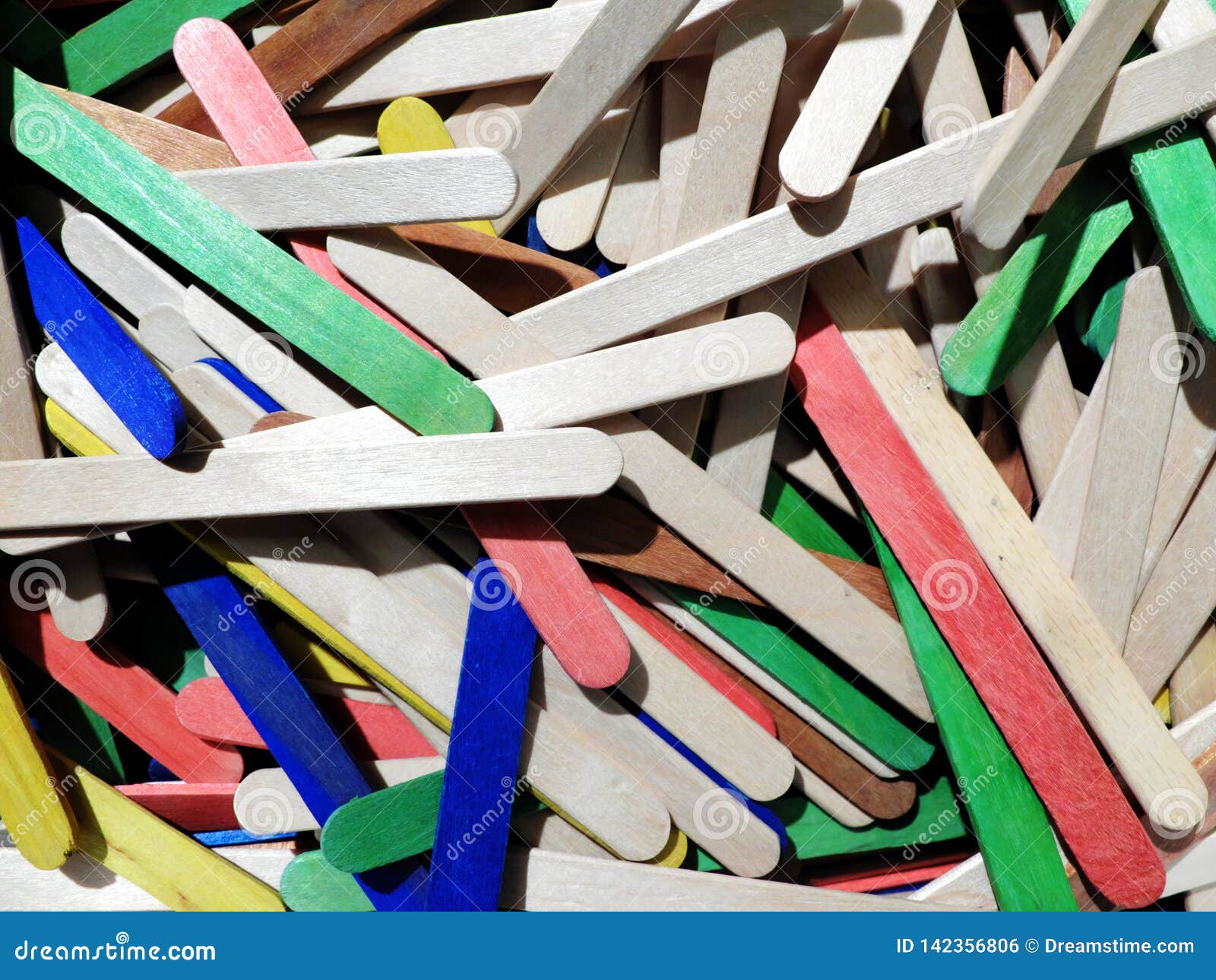Wooden Craft Sticks of Different Colors Under Hard Light Stock Photo ...