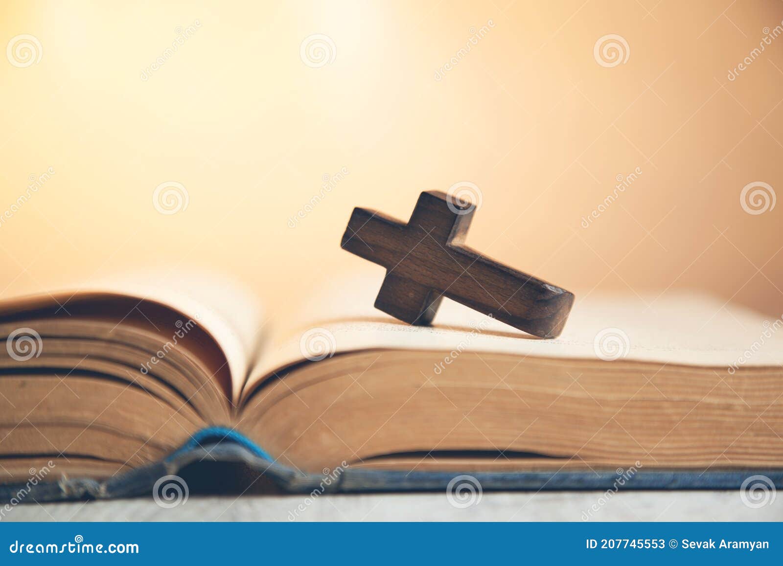 Wooden cross on the book stock image. Image of religion - 207745553