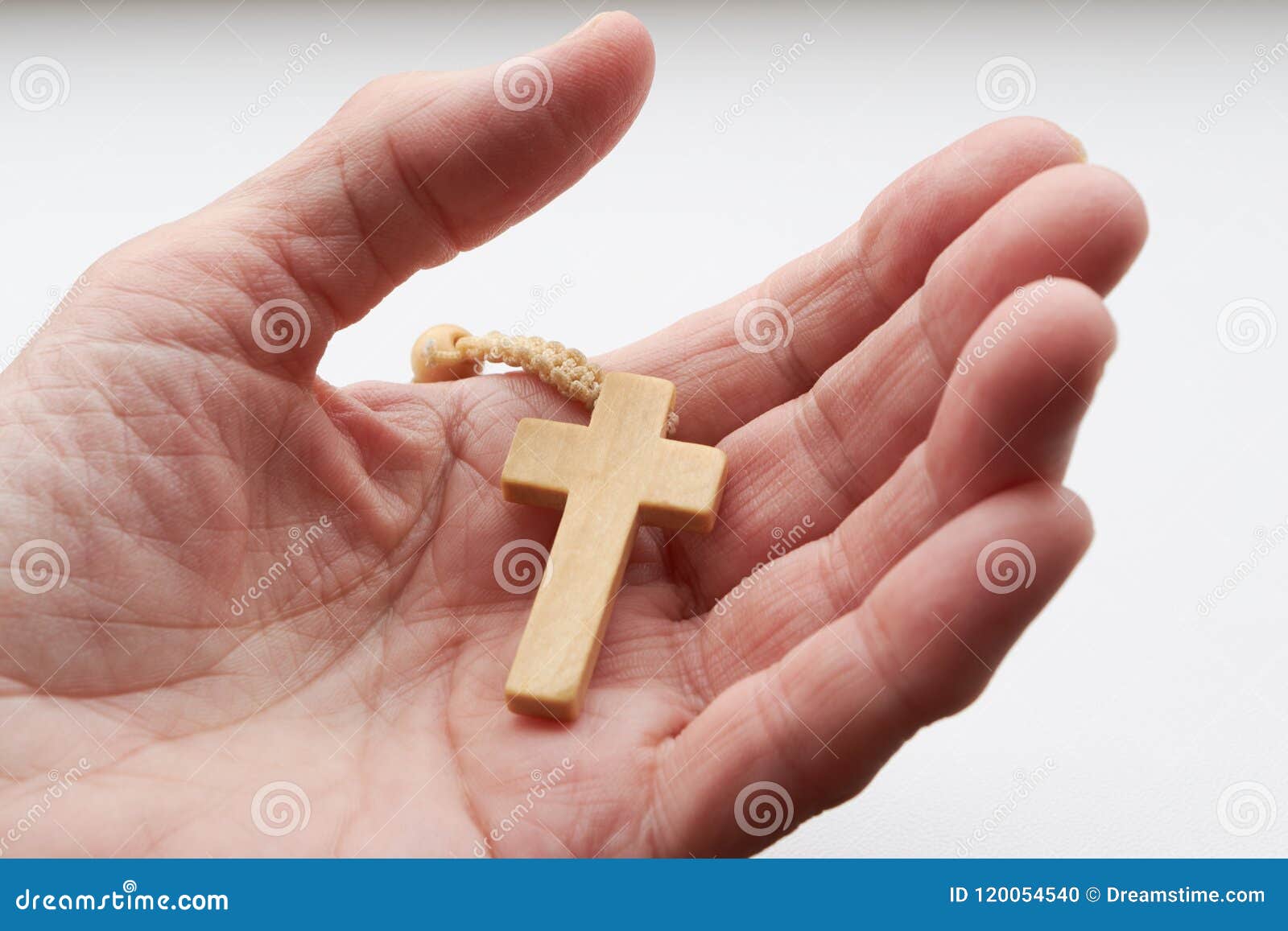 Wooden Cross in the hand stock photo. Image of lord - 120054540