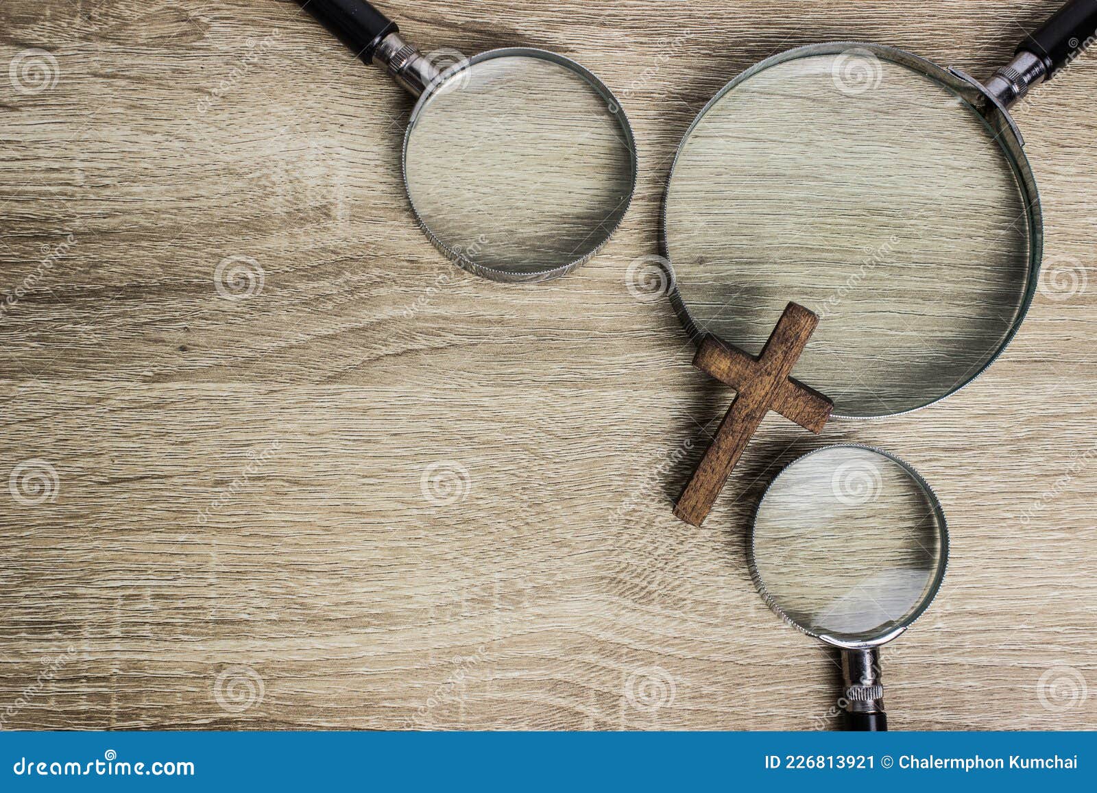 A Wooden Cross with Magnifying Glass on a Wooden Table. Stock Image ...