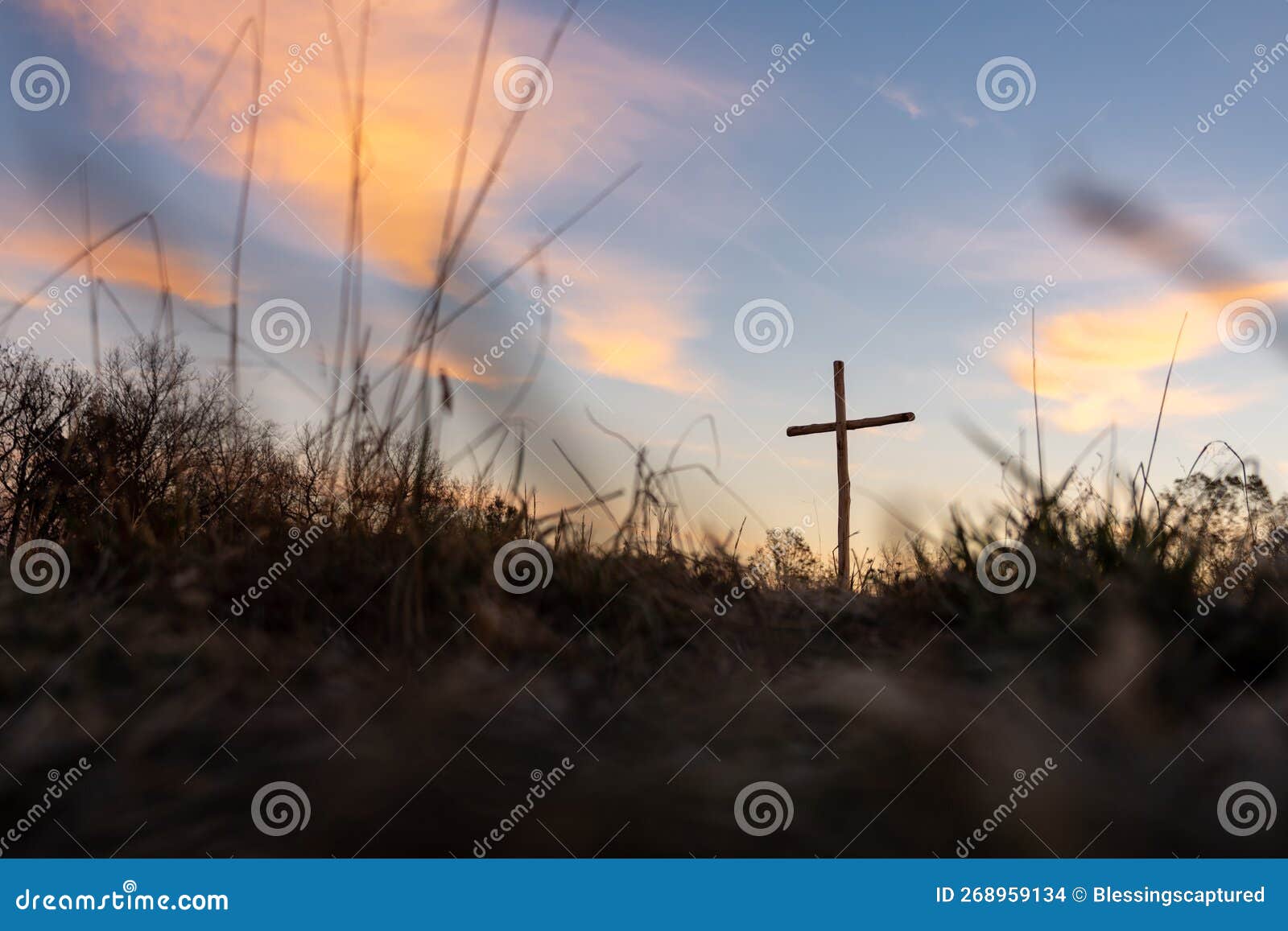 A wooden cross at sunrise stock photo. Image of environment - 268959134