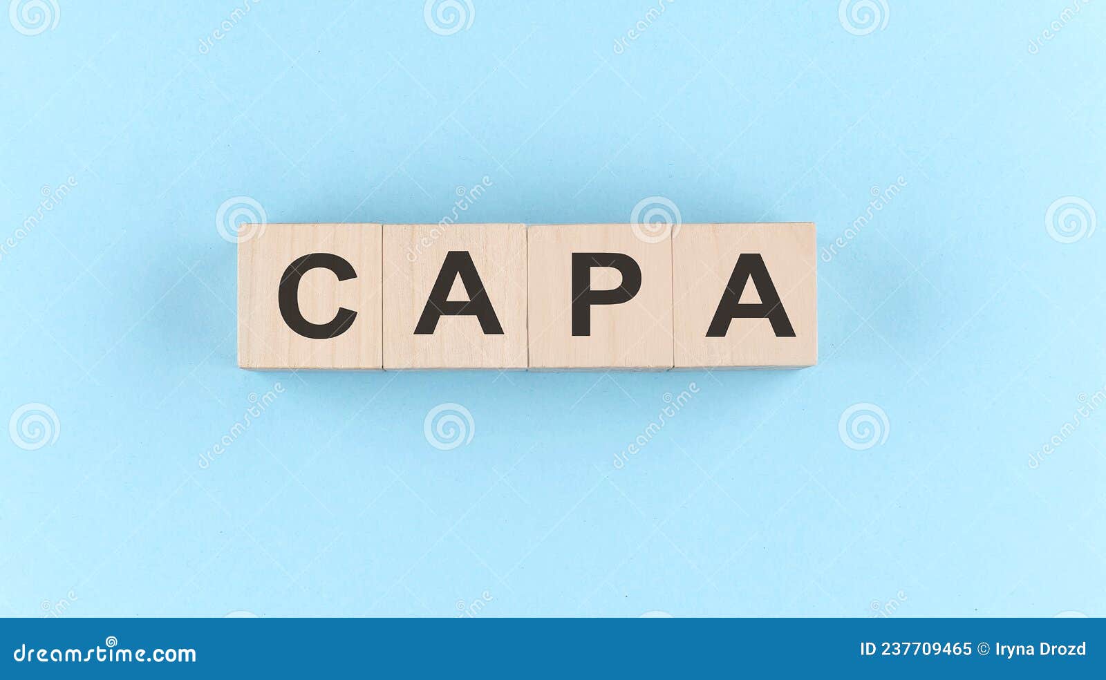Wooden Cube Block with Text CAPA on the Blue Background Stock Image ...