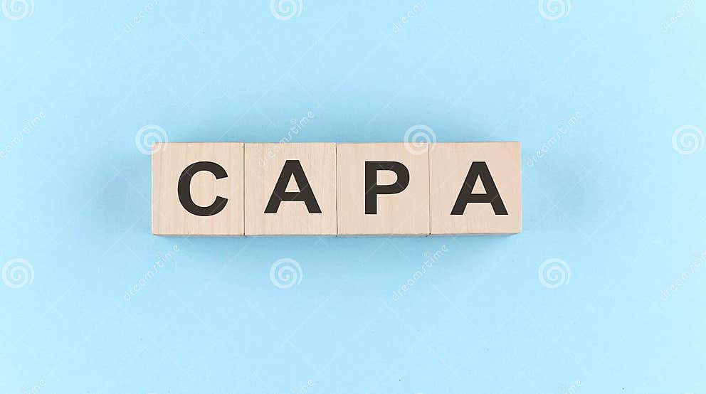 Wooden Cube Block with Text CAPA on the Blue Background Stock Image ...