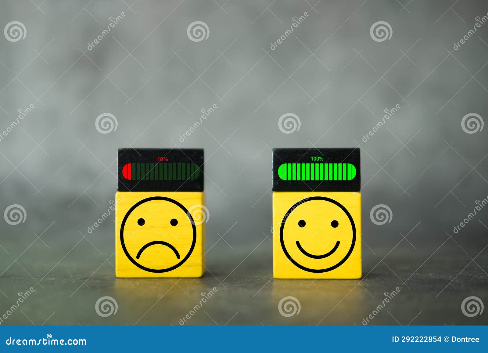 Wooden Cube Blocks with Unhappy Faces and Happy with a Full Battery and ...