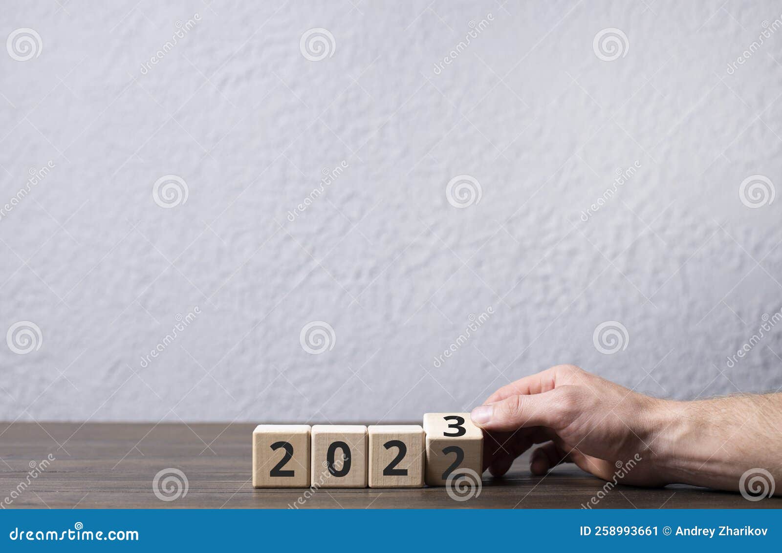 Wooden Cubes. Change 2022 To 2023 New Year. a Hand Flips a Cube Stock ...