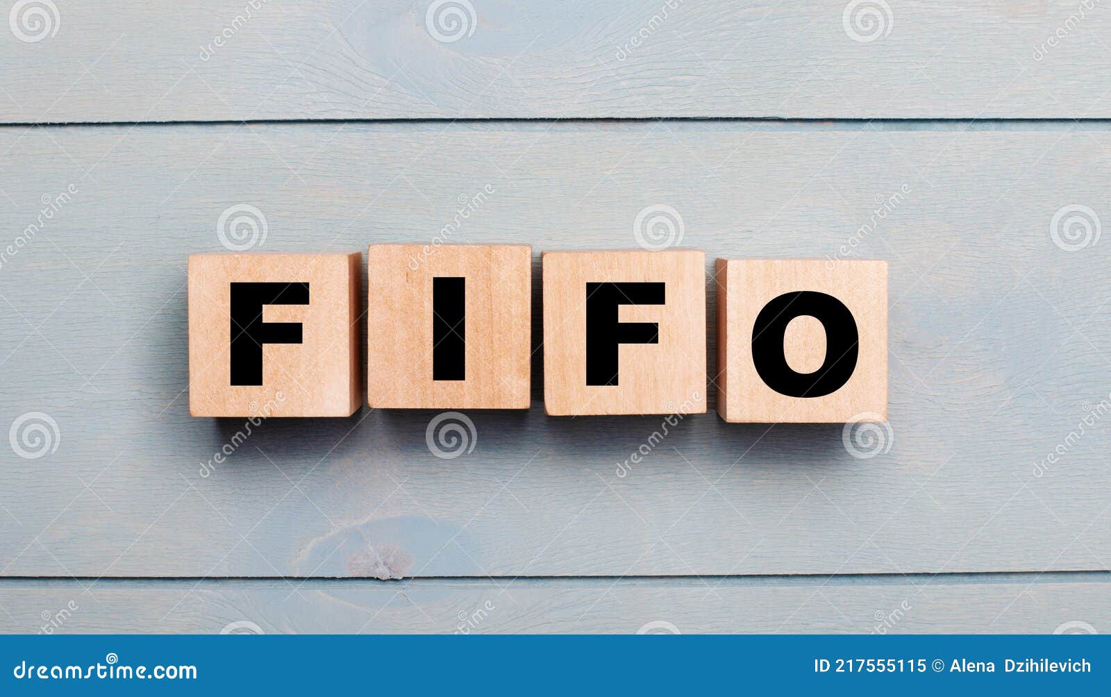 Wooden Cubes with the Text FIFO First in, First Out on a Light Blue ...