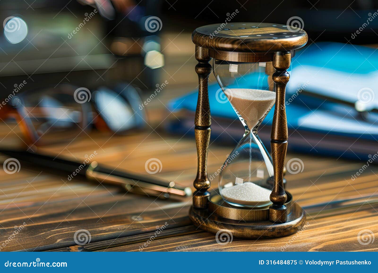 A Wooden Desk with an Hourglass on it Stock Image - Image of office ...