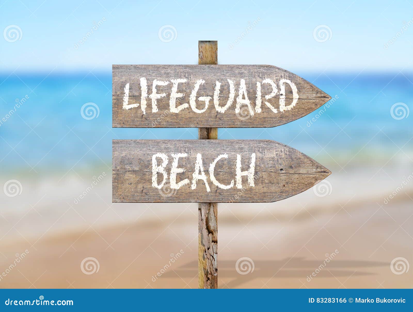 Wooden Direction Sign with Lifeguard Beach Stock Photo - Image of ...