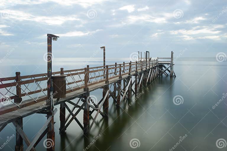 Wooden dock in perspective stock photo. Image of ocean - 16166144