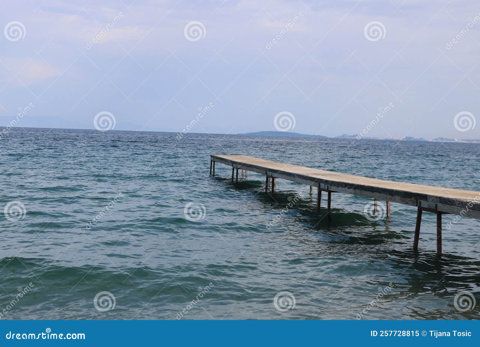 Wooden dock in the sea stock image. Image of shore, wave - 257728815