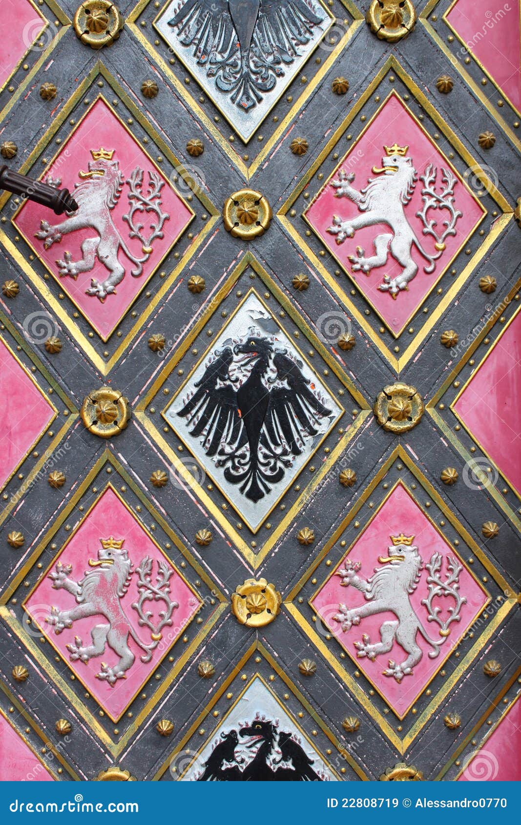 Wooden door with emblems stock image. Image of church - 22808719