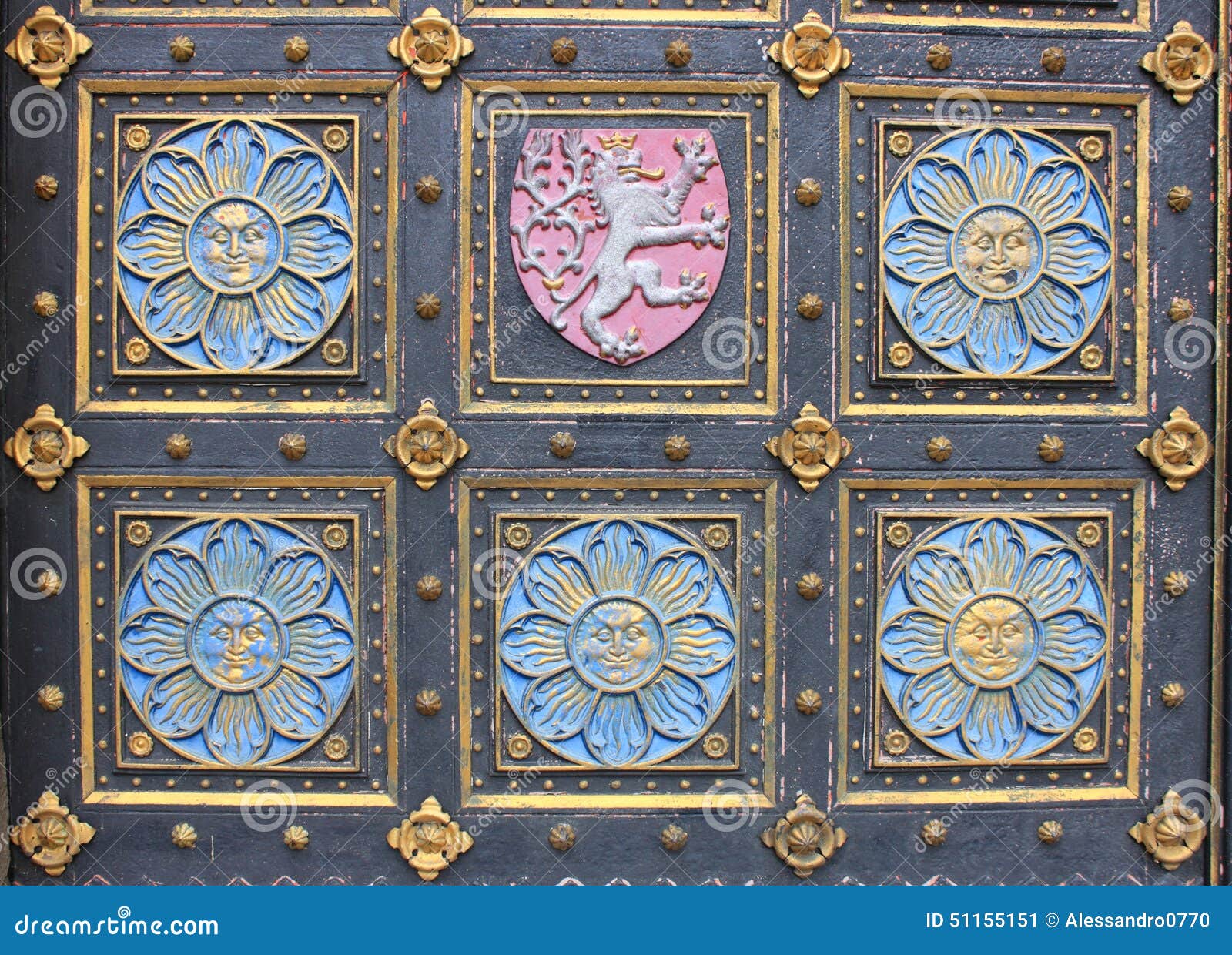 Wooden door with emblems stock image. Image of historic - 51155151