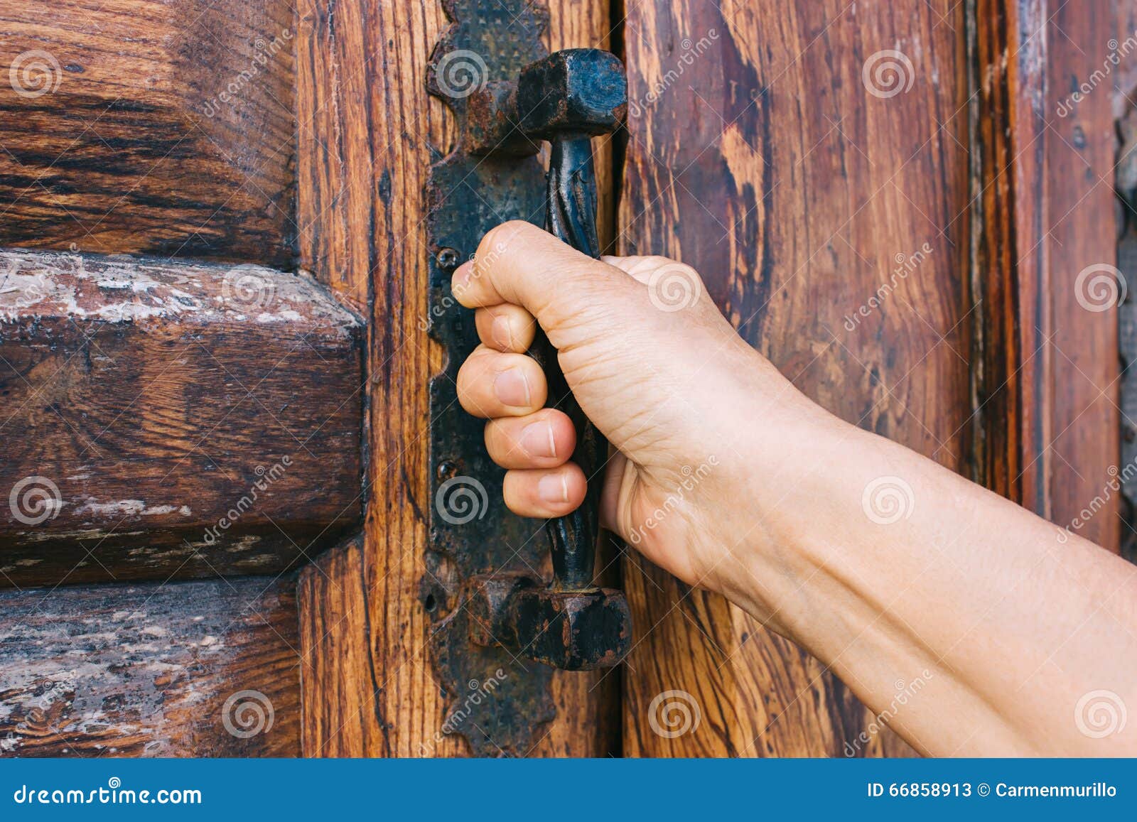 Wooden Door with a Hand on Handle Stock Image - Image of access, unlock ...