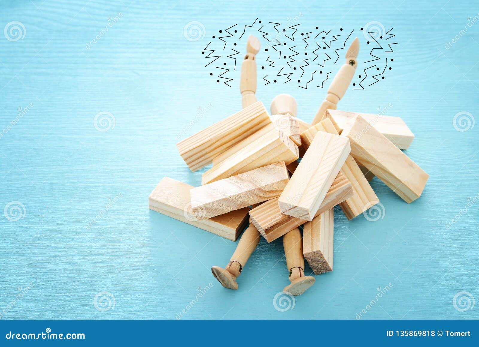Wooden Dummy Buried Under Stack of Domino Blocks Asking for Help ...