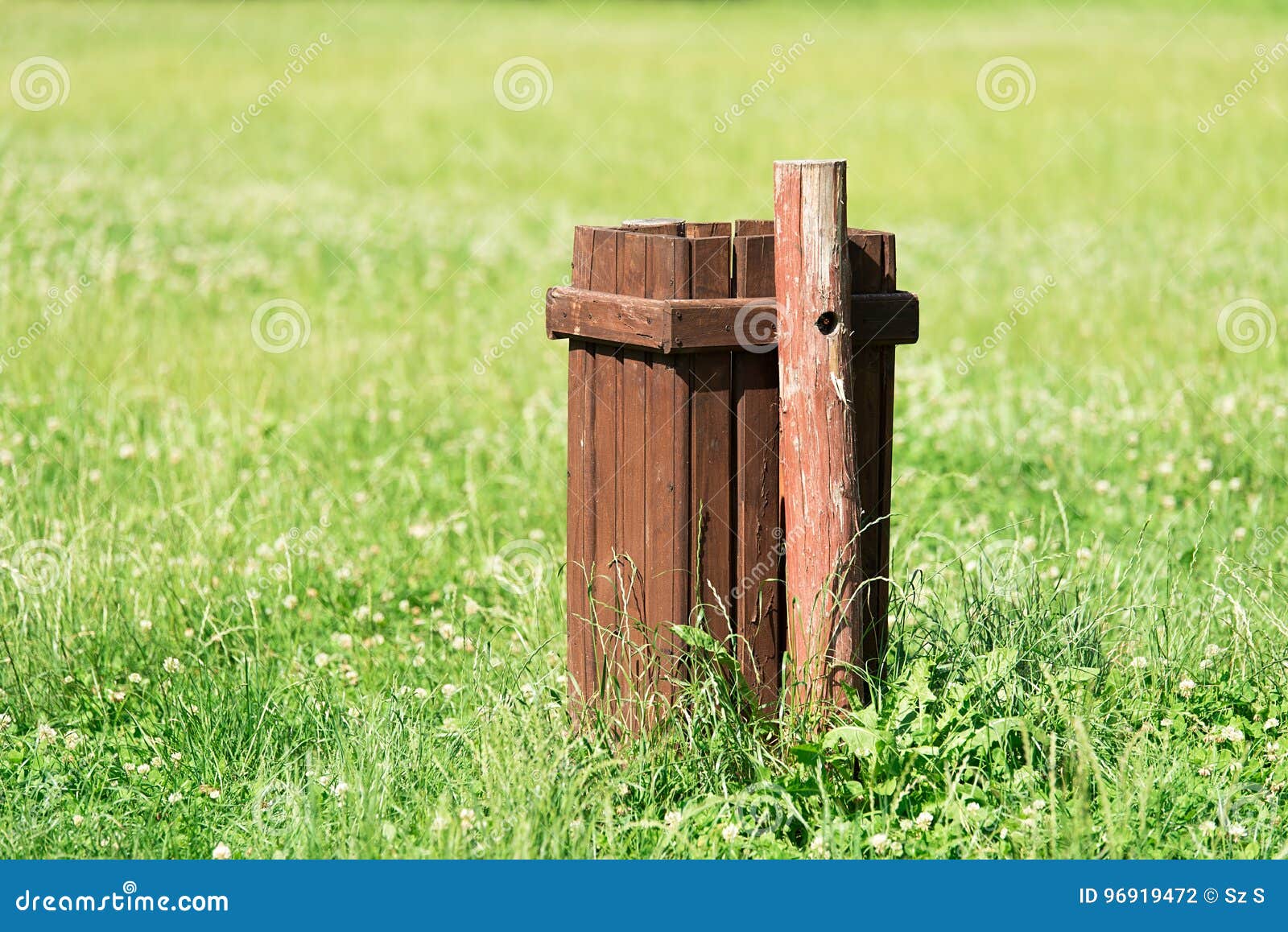 Wooden dustbin in the park stock photo. Image of container - 96919472