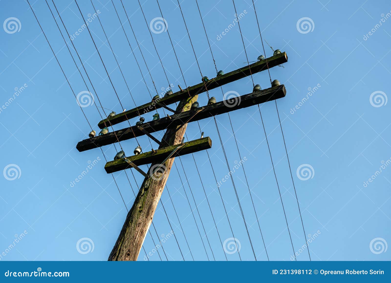 A Wooden, Electric Pole by the Railroad Tracks Stock Photo - Image of ...