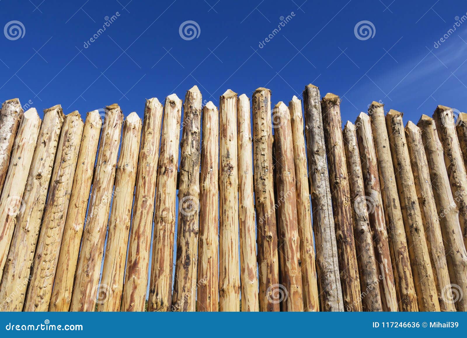 Wooden Fence Made of Sharpened Planed Logs. Stock Photo - Image of ...
