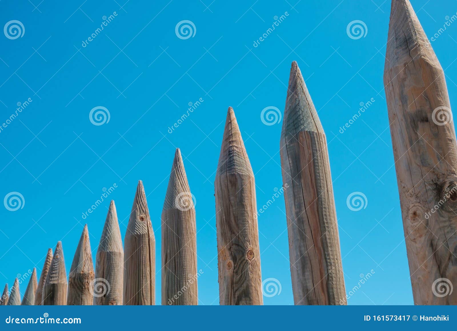 Wooden Fence Made of Sharpened Wood Poles - Protective Wall Stock Image ...