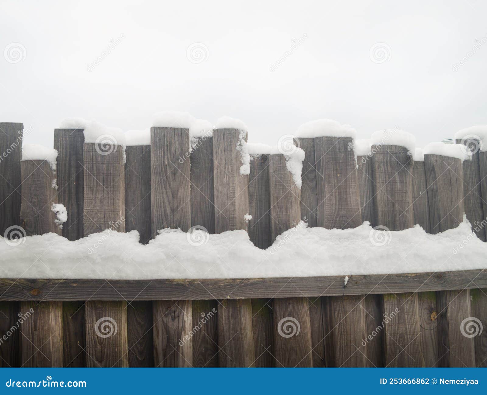 Wooden fence at winter stock photo. Image of border - 253666862